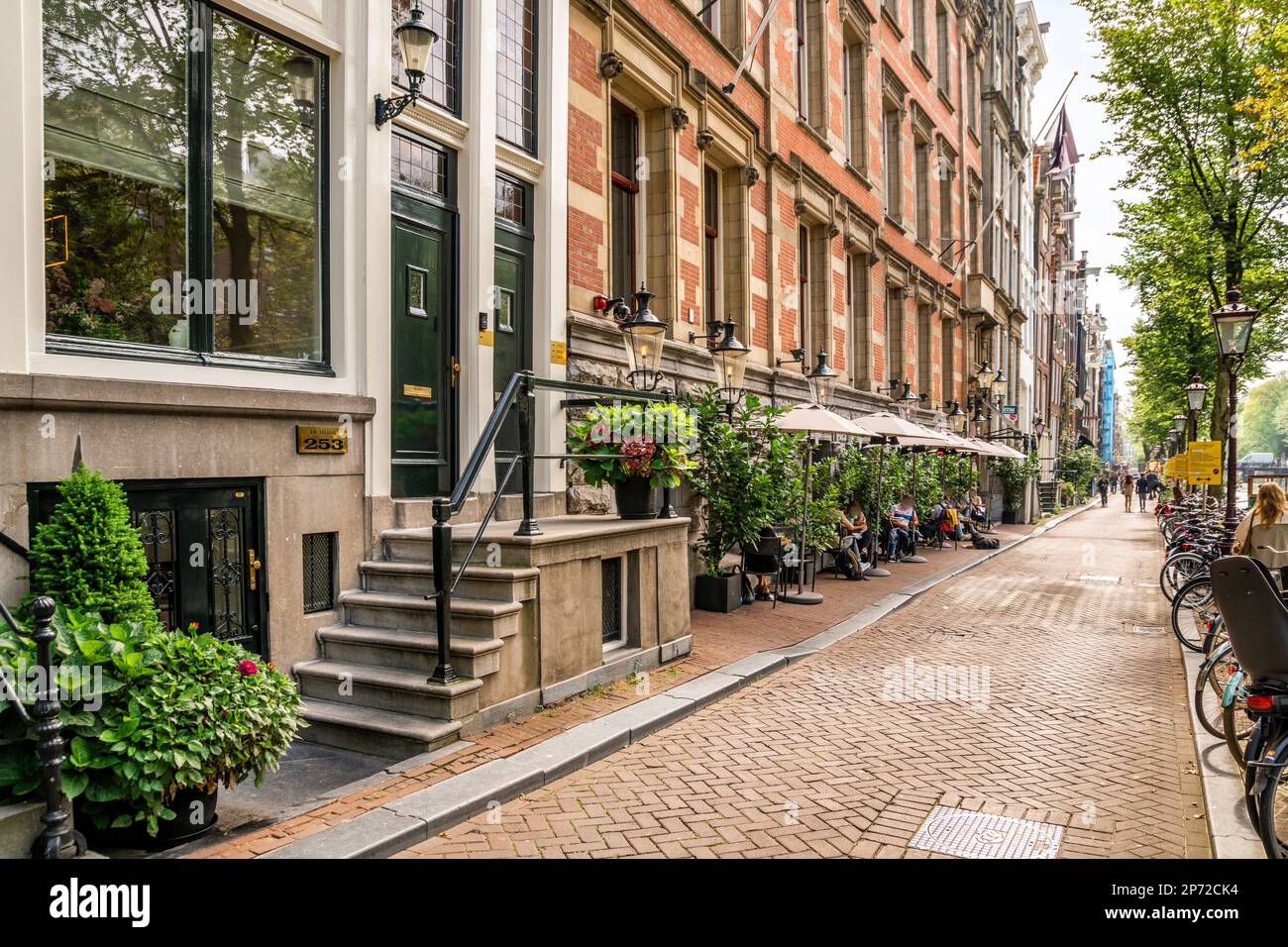 Amsterdam, Netherlands - 10 April, 2021: a city street with people ...