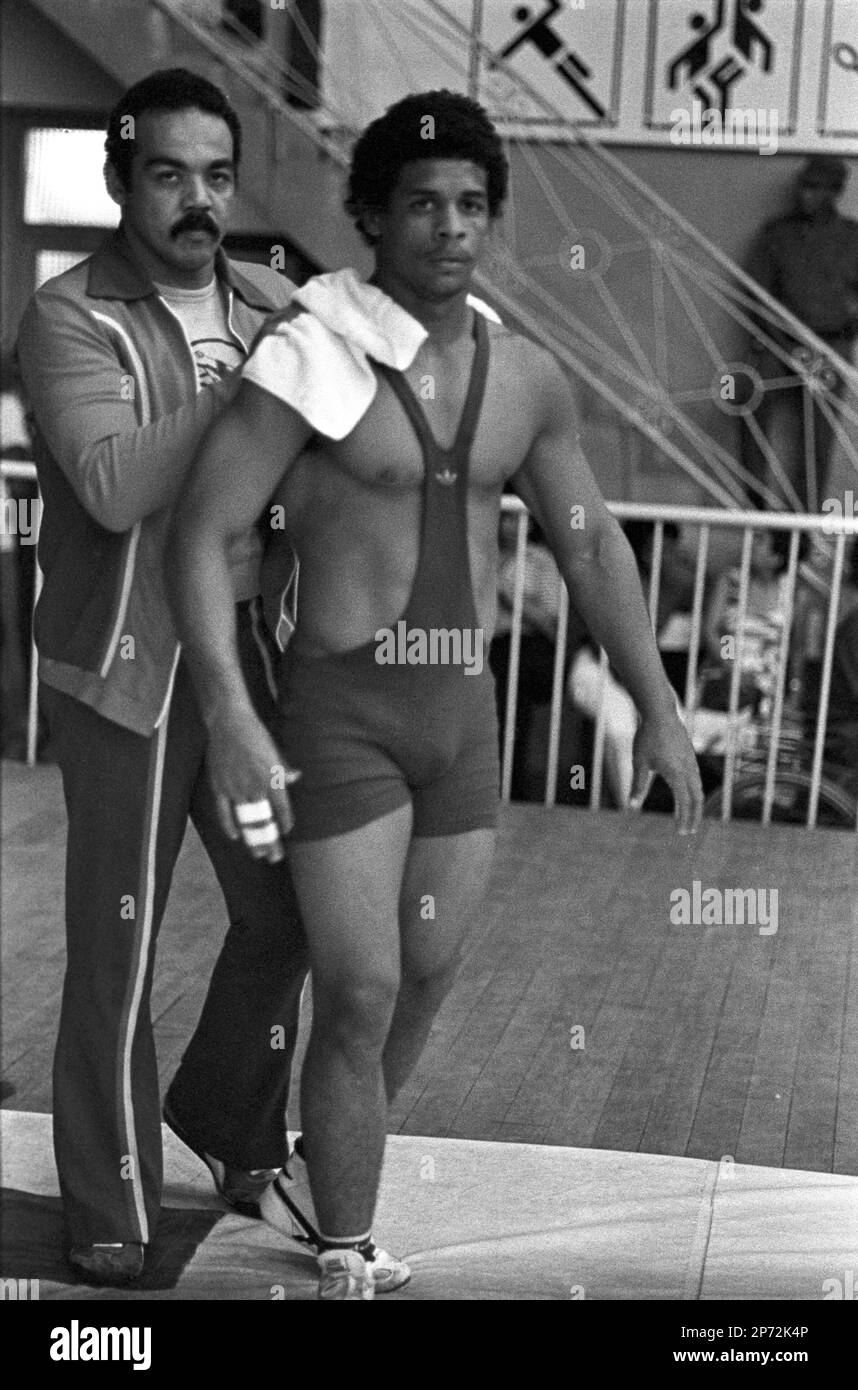 Cuban wrestler Raul Cascaret, right, arrives to compete in Cerro Pelado ...