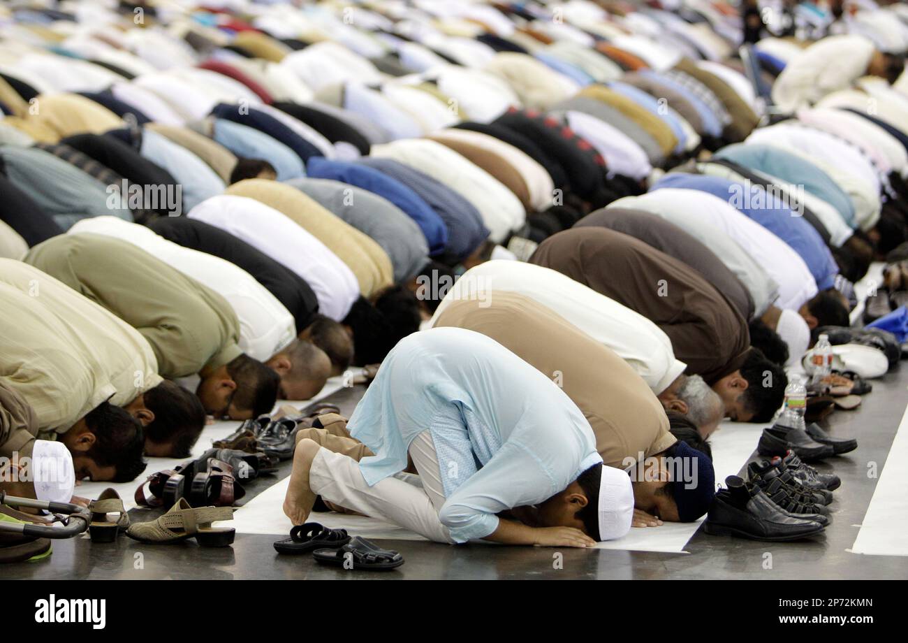 Rows of men during the annual Eid prayer at the George R. Brown ...