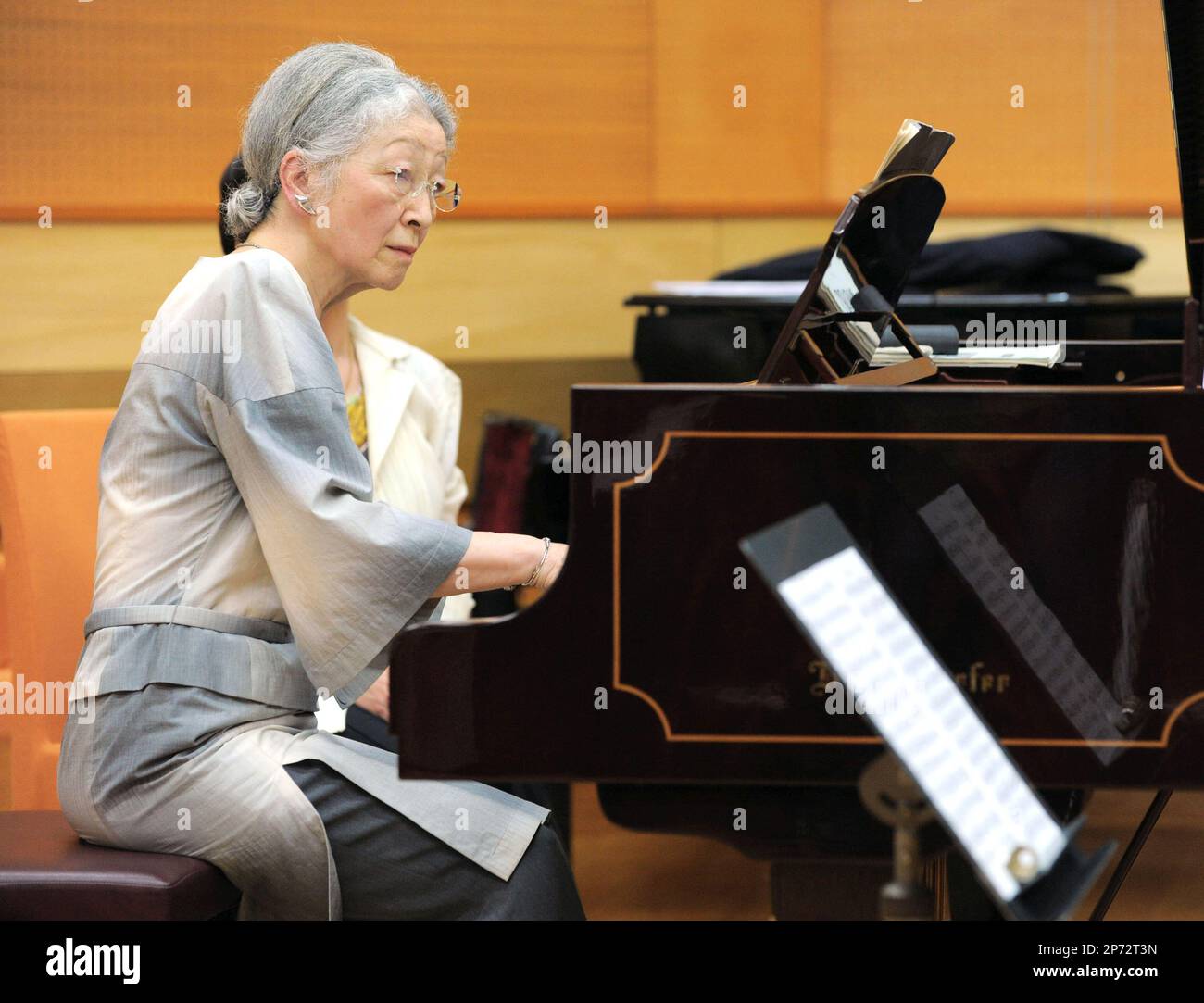 Japanese Empress Michiko is playing the piano at the annual Kusatsu ...