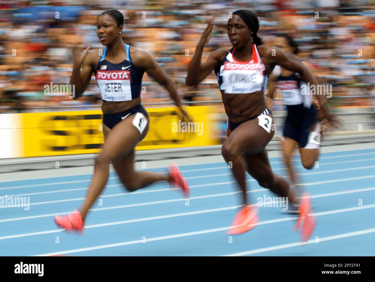 USA's Carmelita Jeter, left, and Britain's Jeanette Kwakye compete in a ...