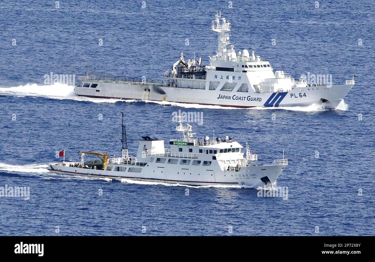 An aerial picture from Yomiuri jetliner shows Japan Coast Guard patrol ...