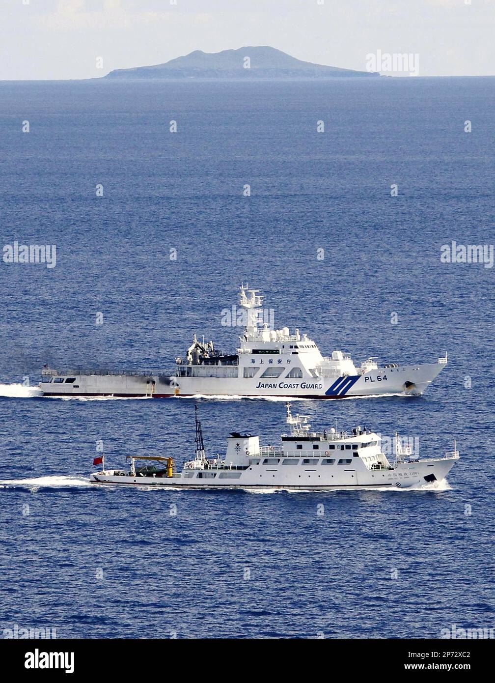 An aerial picture from Yomiuri jetliner shows Japan Coast Guard patrol ...