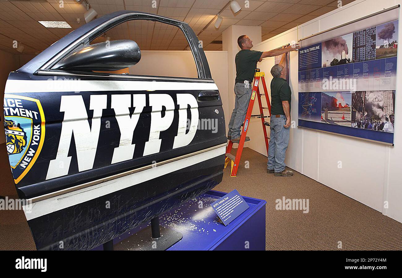 Brian Gregory, on ladder, and Kelly Dugan, of the New York State ...