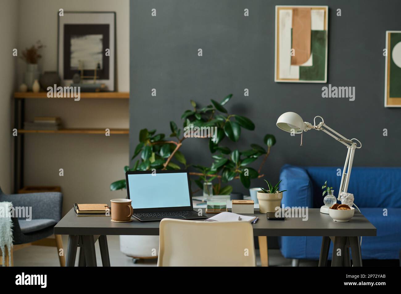 Workplace with computer for remote work in modern living room Stock ...