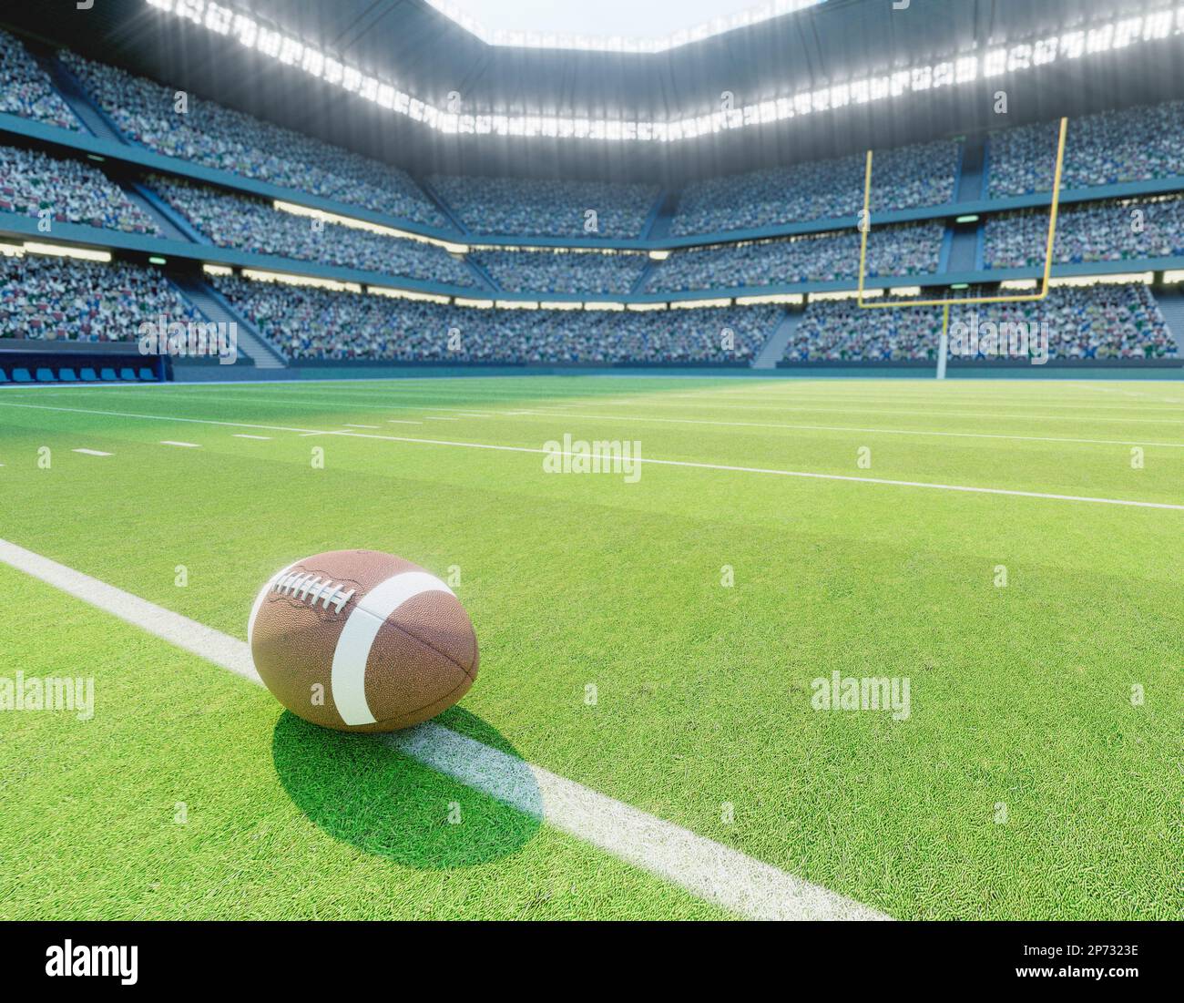 An American football on the centre line in a stadium with posts on a ...