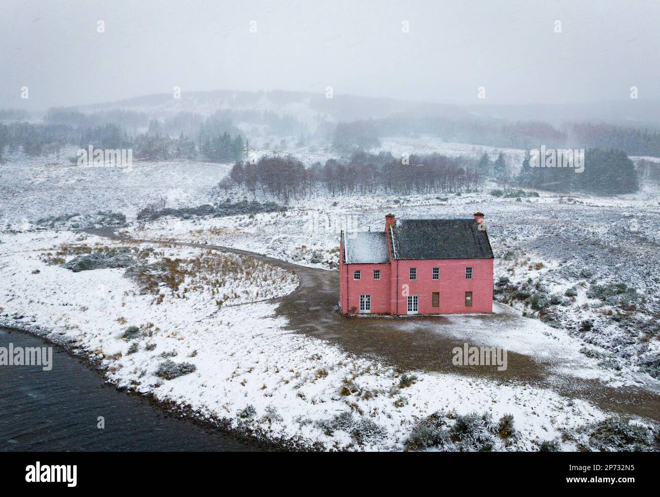 Aerial views of Culzie Lodge also known as The Pink House in snow on ...