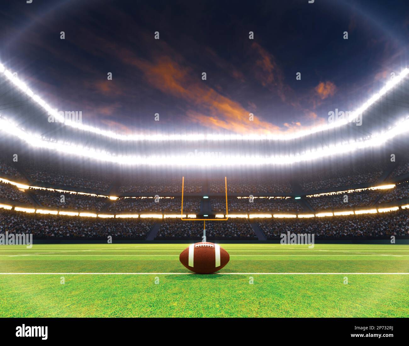 An American football on the centre line in a stadium with posts on a ...