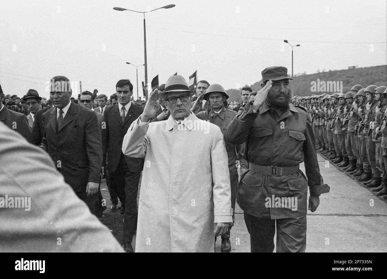 Cuban leader Fidel Castro, center right, reviews troops during his ...