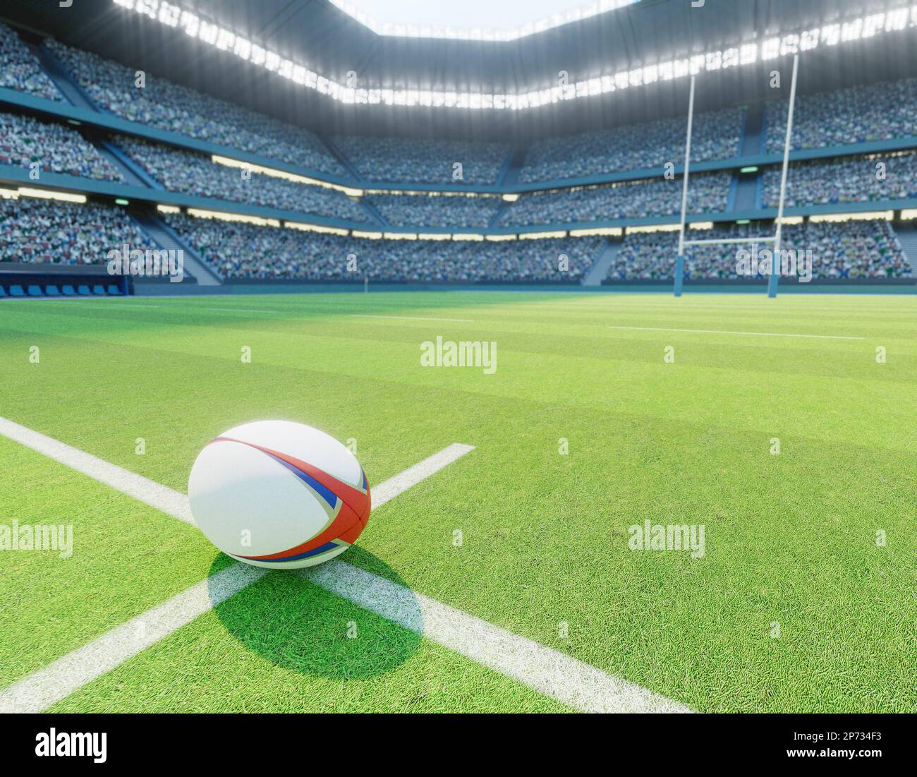 A rugby ball on the centre line of a rugby stadium with posts on a ...
