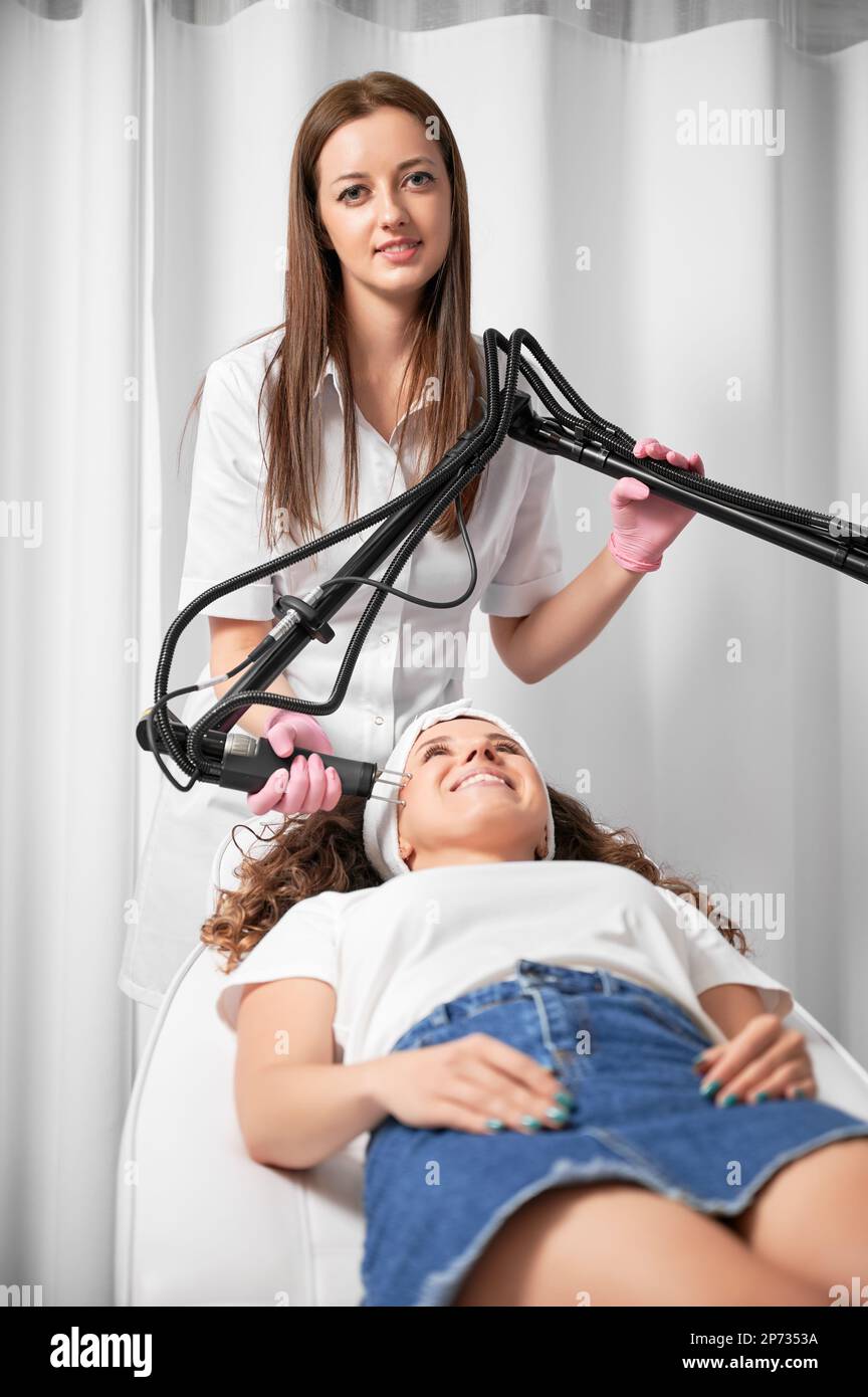 Visiting beautician to treat post-traumatic acne scars. Female ...