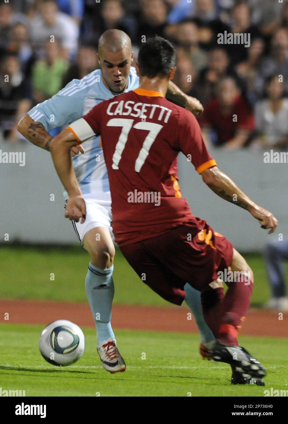 SK Slovan Bratislava's Filip Sebo, left, challenges AS Roma's Marco ...