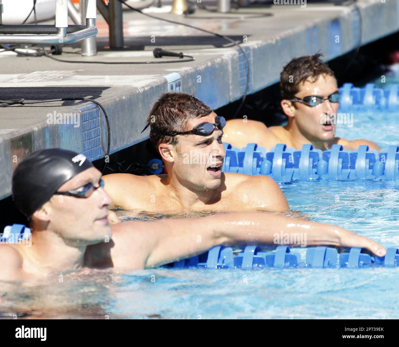 Eric Shanteau (TROJAN SWIM CLUB), center, wins the mens 200 meter ...