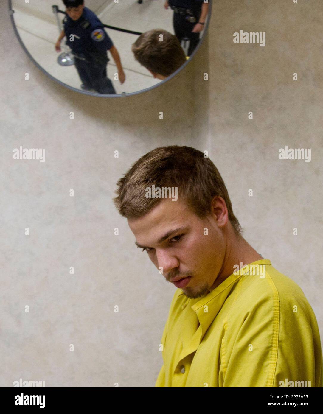 Ryan Dougherty is escorted to court for an appearance in Pueblo, Colo ...