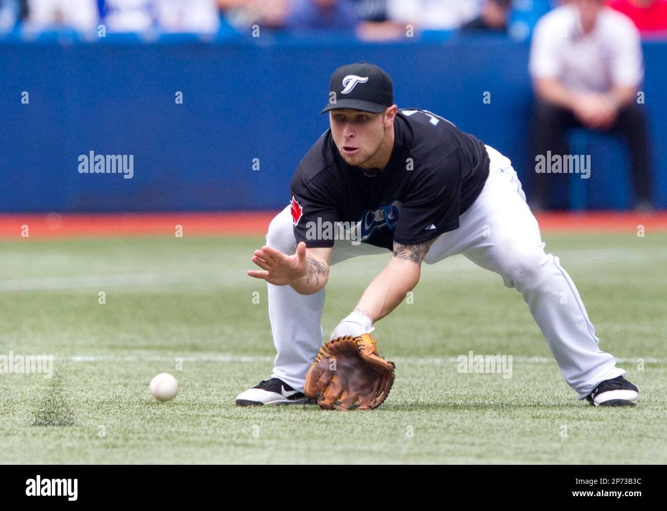 Toronto Blue Jays' Brett Lawrie corrals a ground ball off the bat of ...