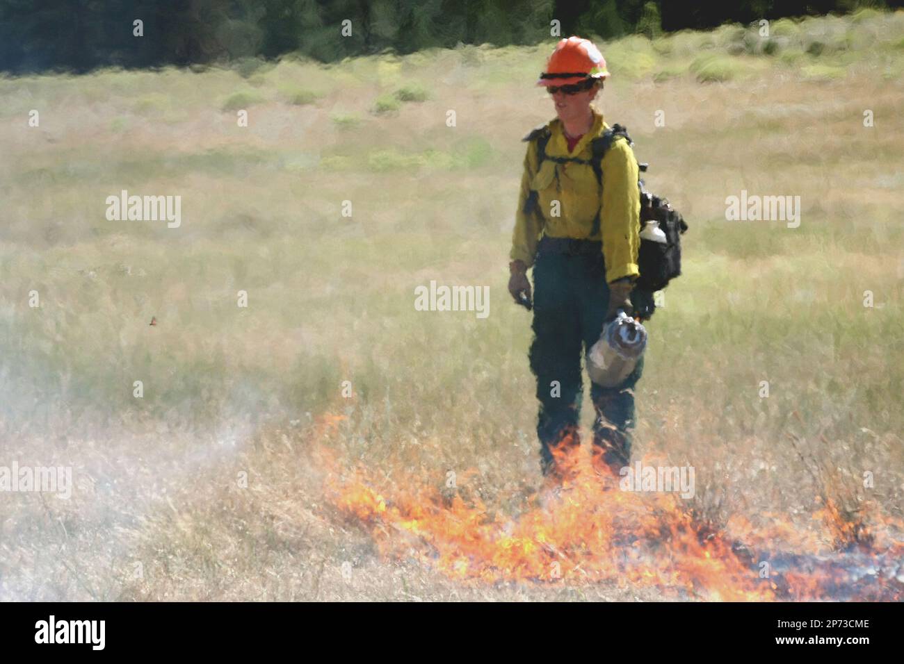 Zig Zag Hot Shots lead burner Sandra Sperry lays fire in an unburned ...