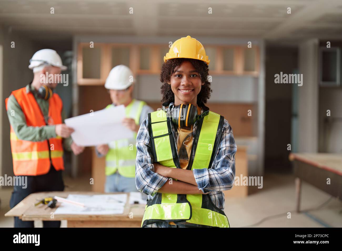 Foreman builder woman at construction site. American African foreman ...