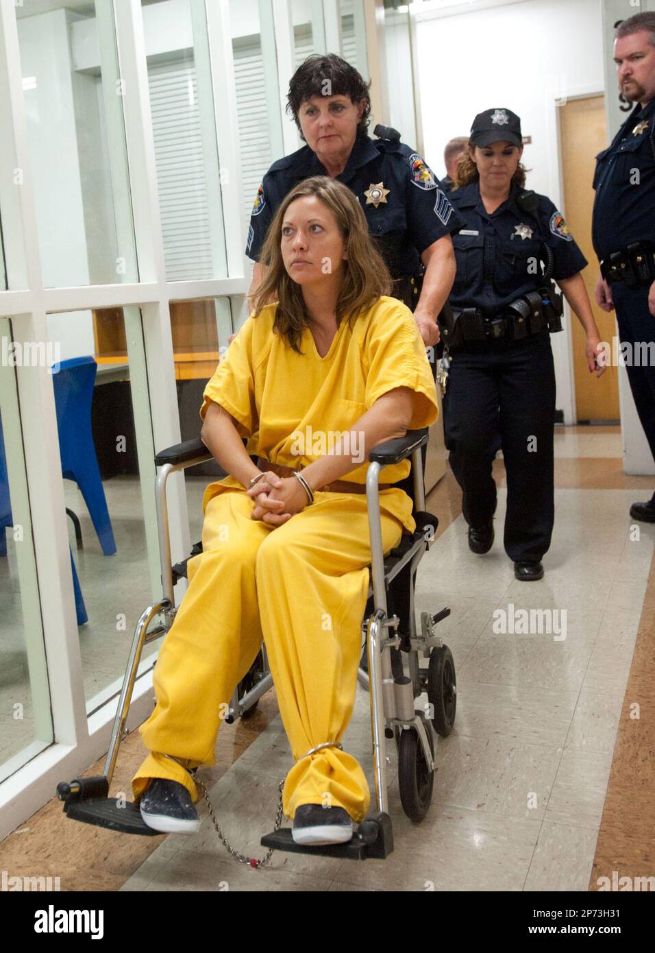 Ryan Edward Dougherty, 29, in wheel chair, is brought to an advisement ...