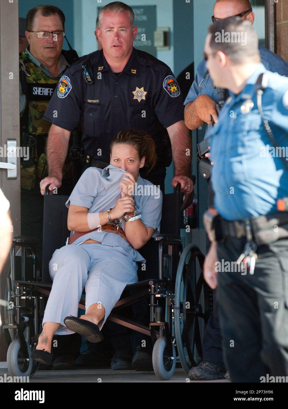 Lee Grace Dougherty, 29, in wheelchair, is wheeled by Pueblo County Sherrif's Office Capt. Liede ...