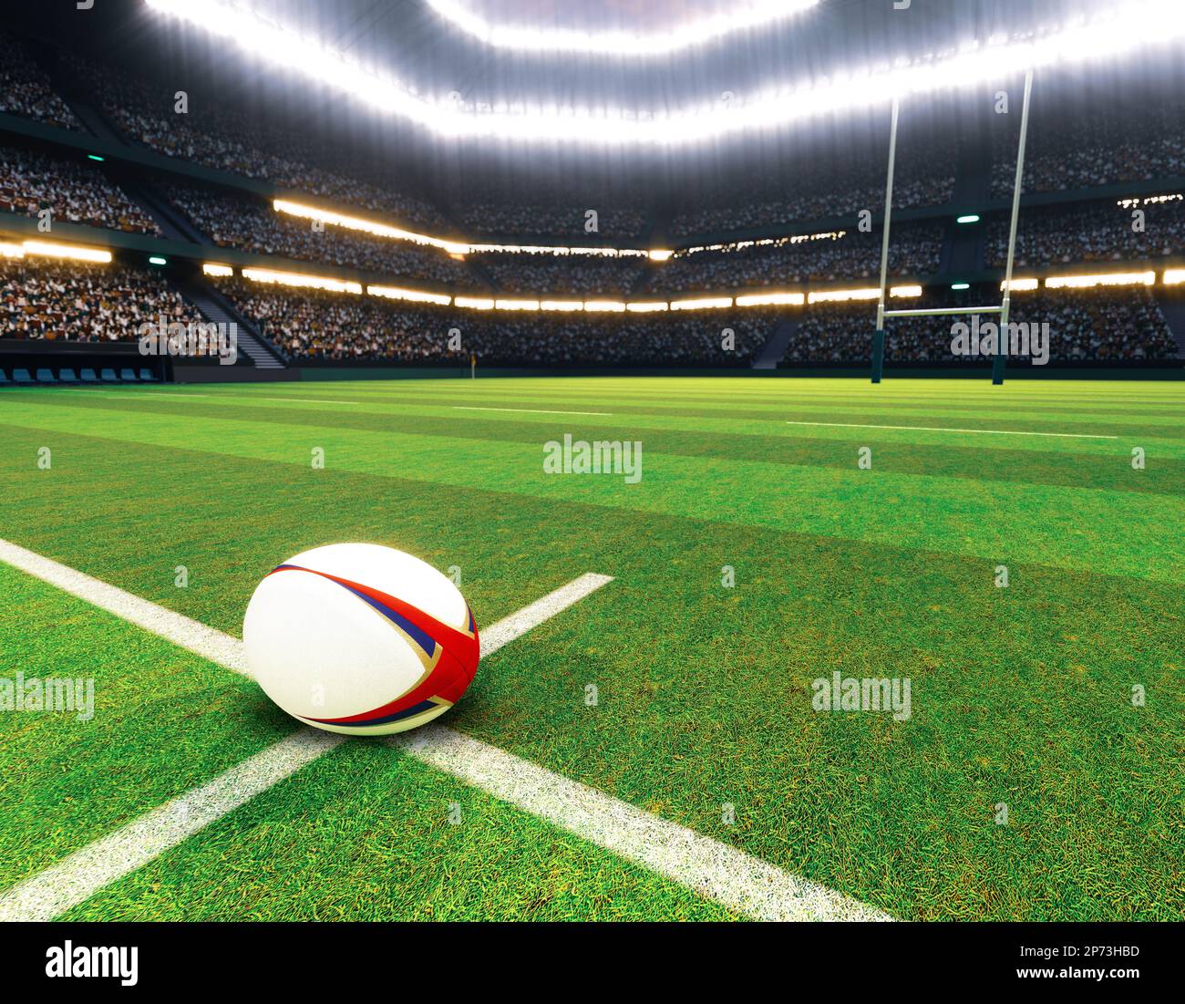 A rugby ball on the centre line of a rugby stadium with posts on a ...