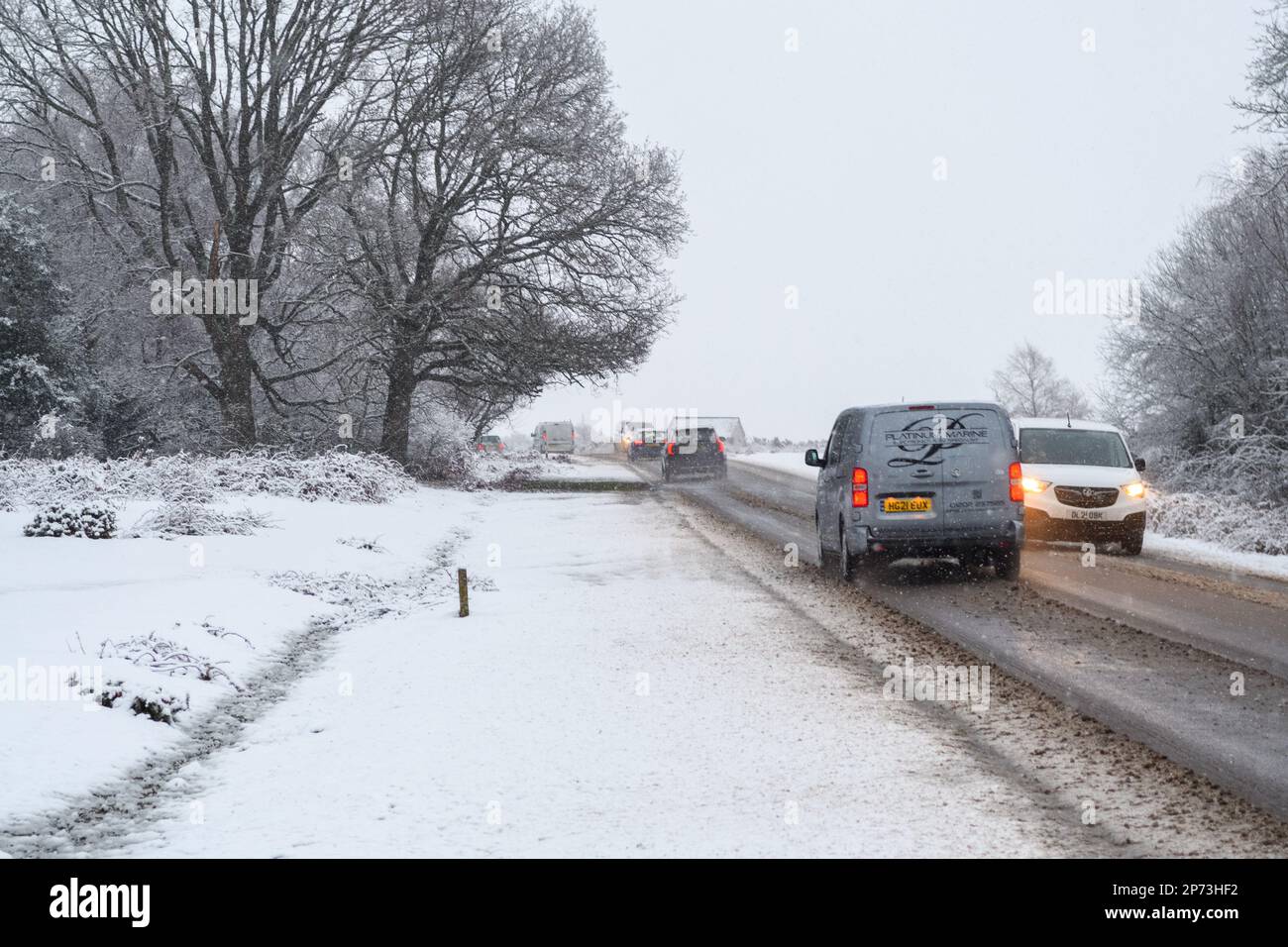 Traffic in snow, Godshill, New Forest, Hampshire, England, UK, 8th ...