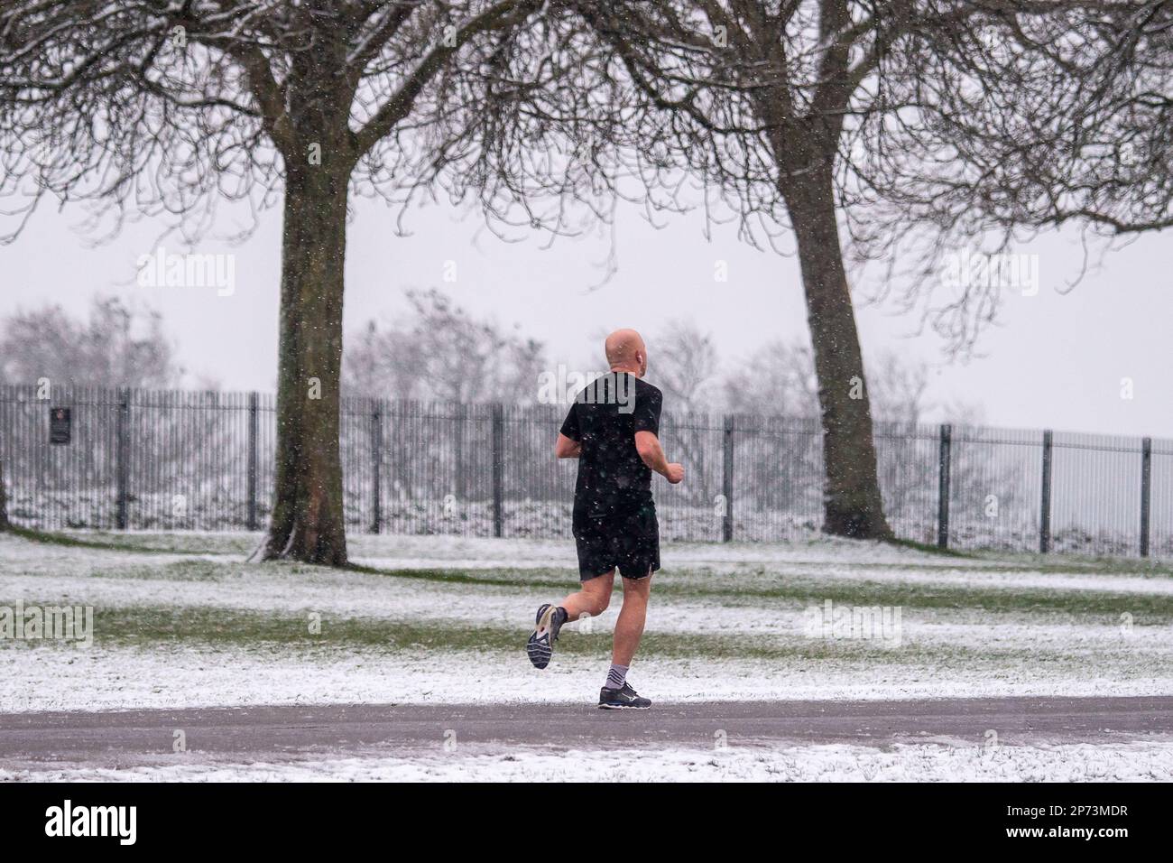 Windsor, Berkshire, UK. 8th March, 2023. Walkers and joggers were out ...