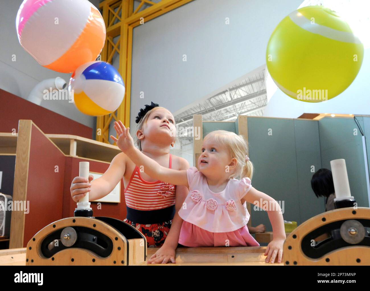 Samantha Mayberry, 5, left, and her sister Raegan Mayberry, 2, play on ...
