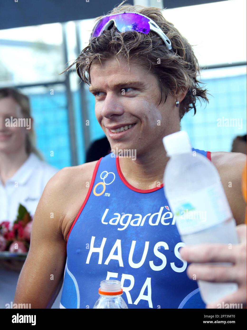 David Hauss, of France, who placed 3rd, after crossing the finish line ...