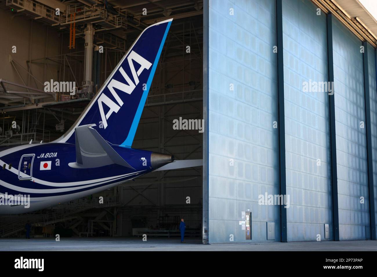 Hangar doors open during the reveal of the first Boeing 787 destined ...
