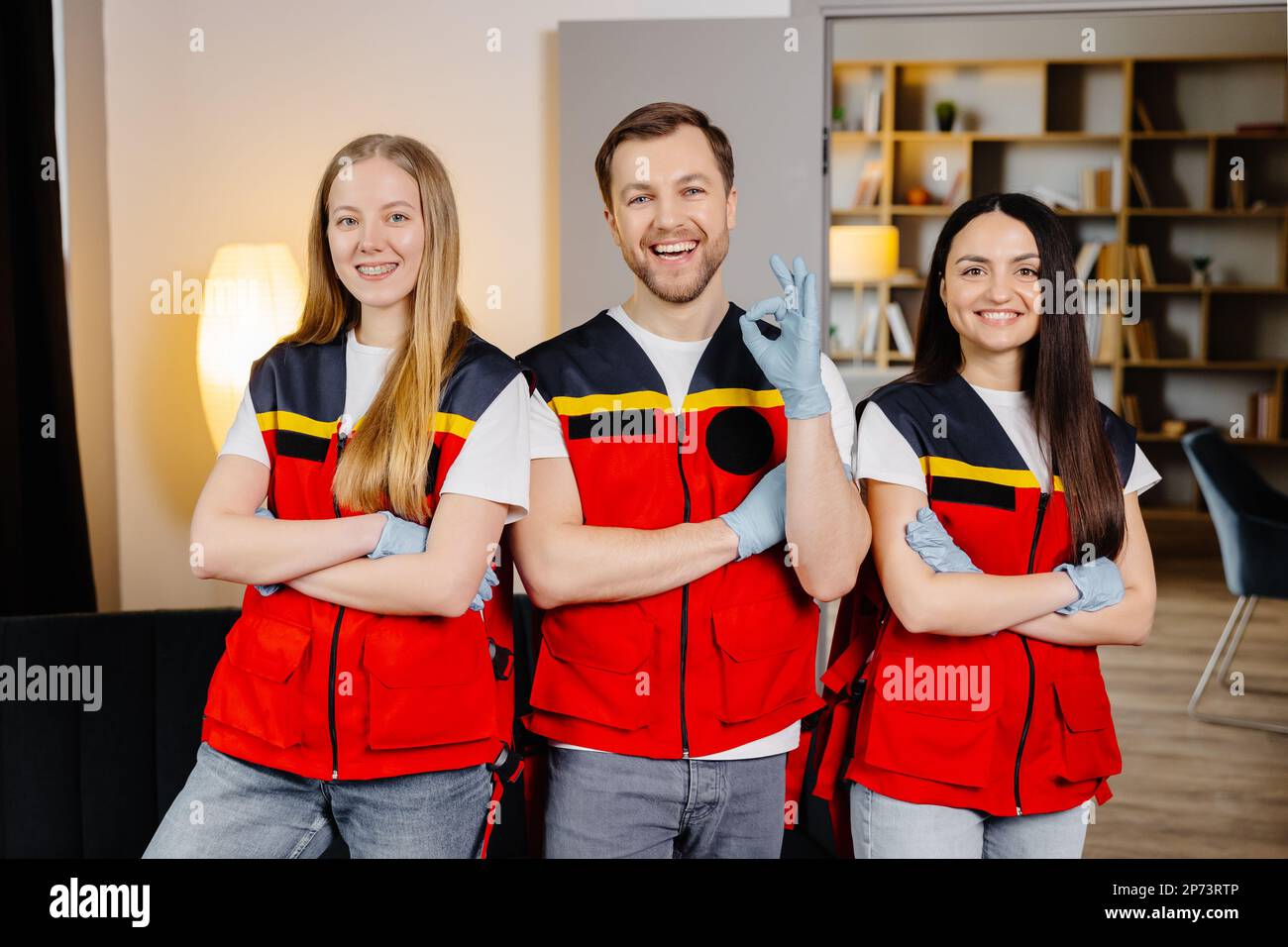Group of people with cpr dummy looking at camera and smiling after ...
