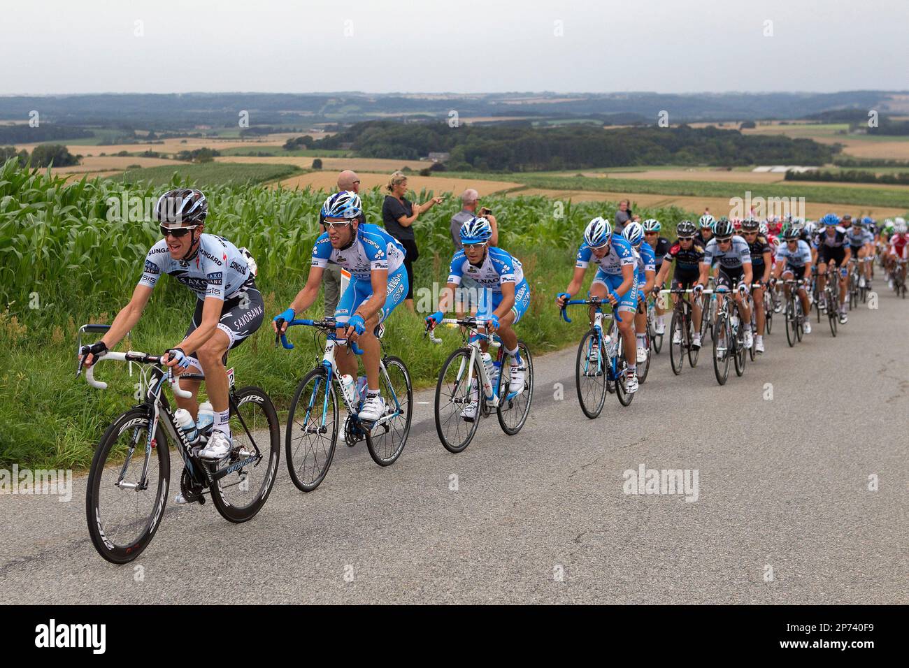 Chris Anker Sorensen, of Denmark, leads the pack in front of four Team ...