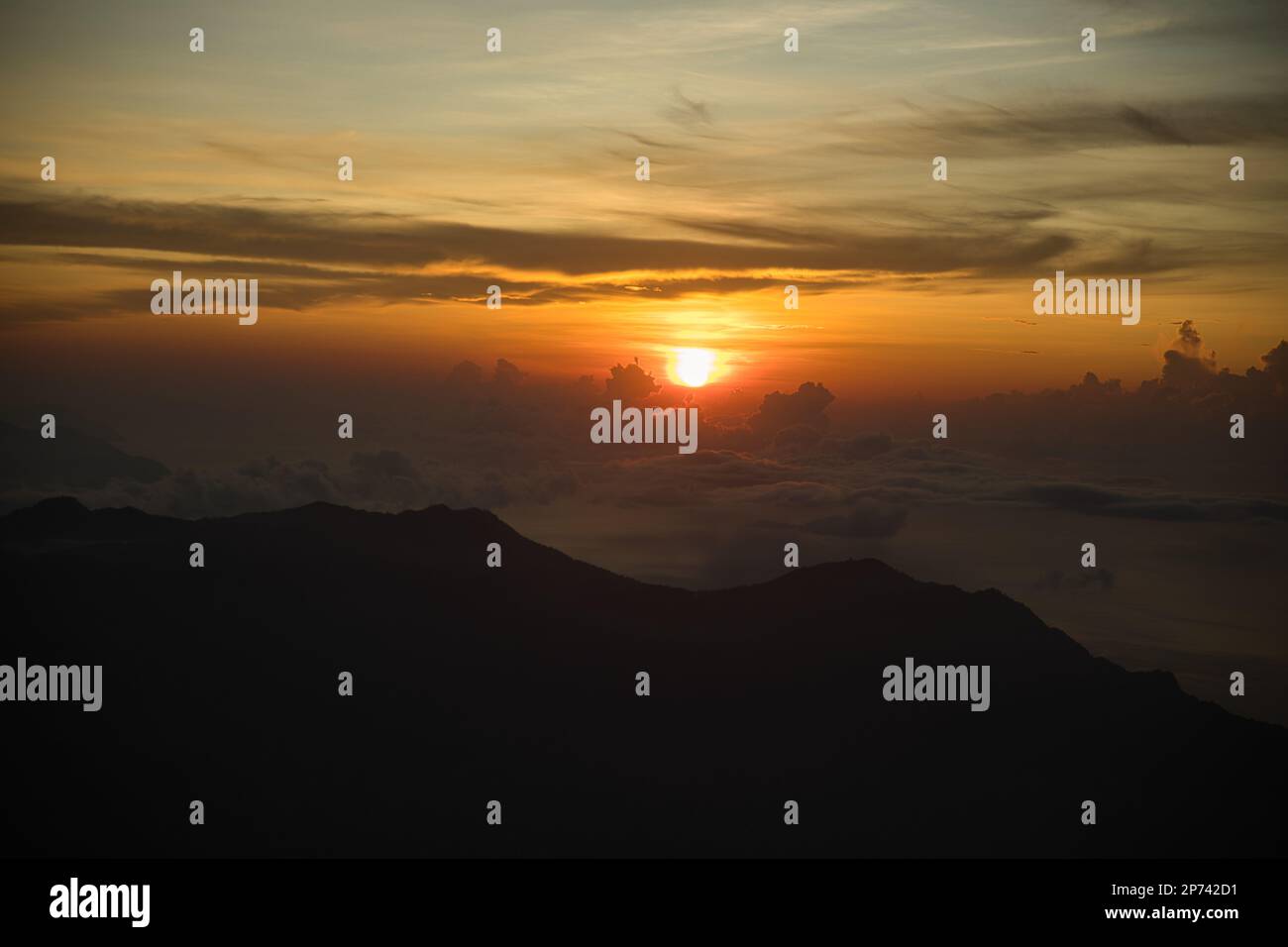 Epic sunrise on the top of the mountain Inerie on Flores, the sun ...