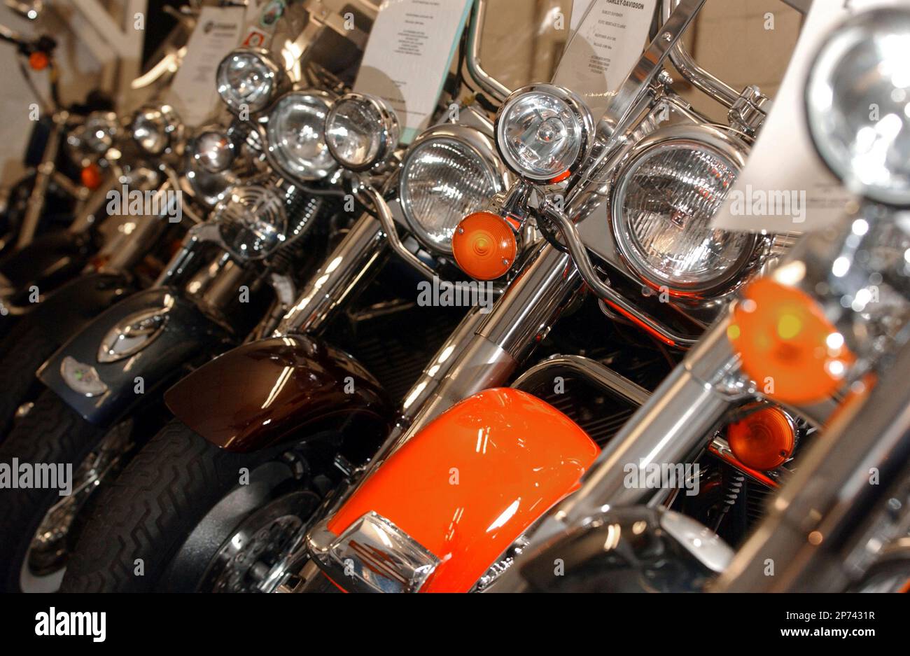 Line up of Harley-Davidson motorbikes inside a Harley-Davidson ...