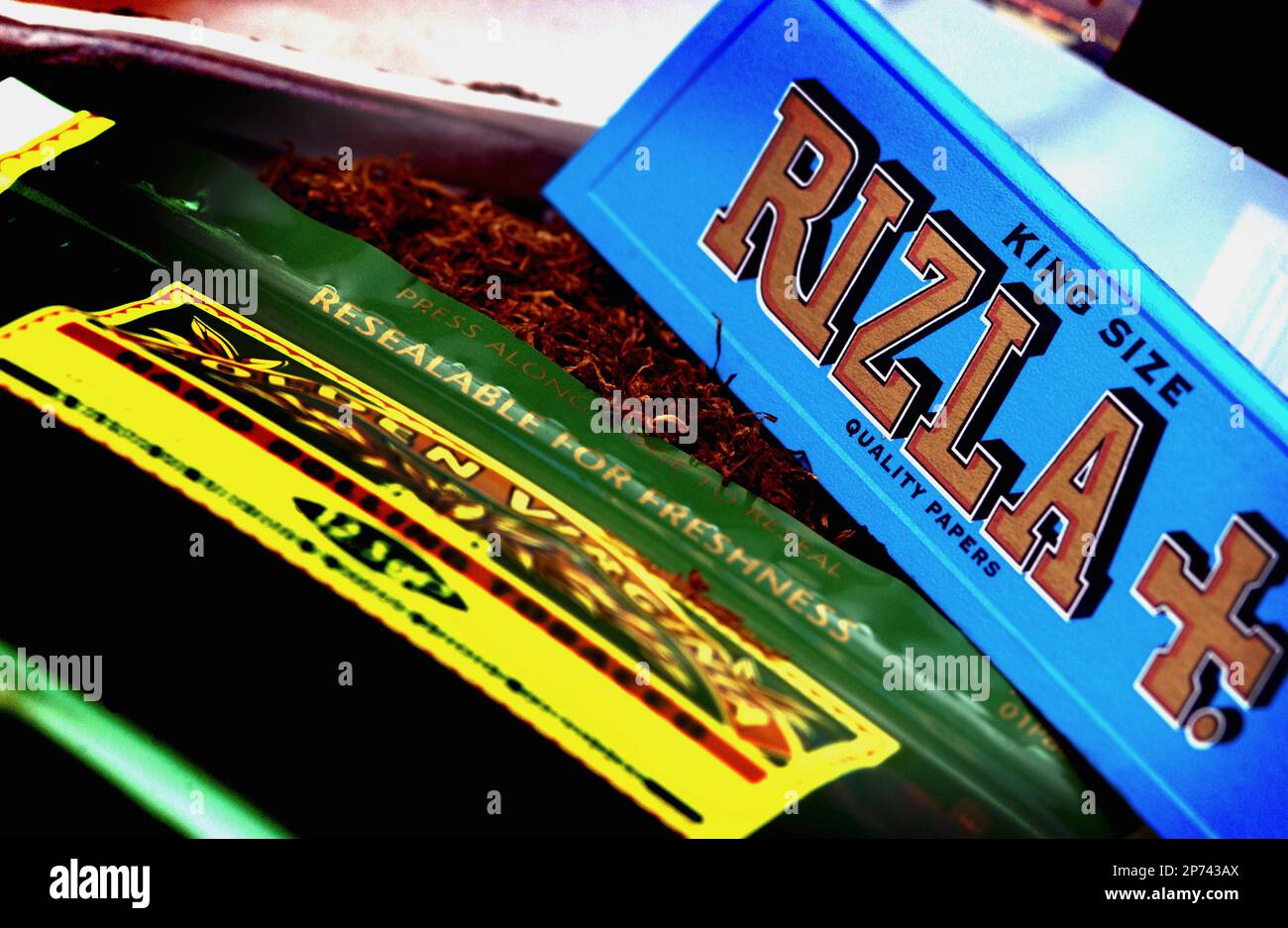 Picture shows A packet of Rizla Blue cigarette papers and a pouch of ...