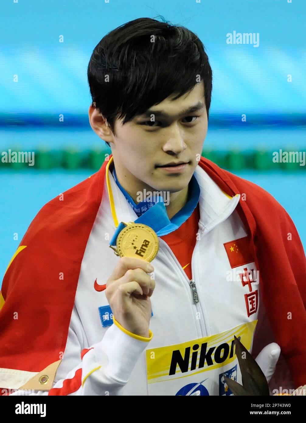 Jul 31, 2011; Shanghai, CHINA; Sun Yang of China poses with the gold ...