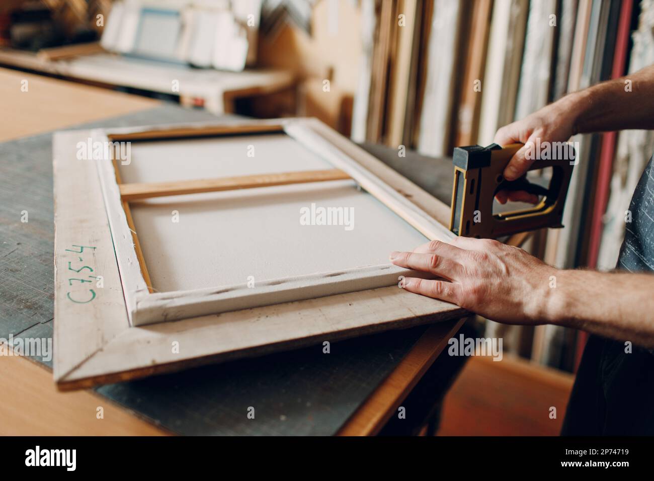 Framing Workshop assembling. Stapler ruler and frames baguette handmade ...