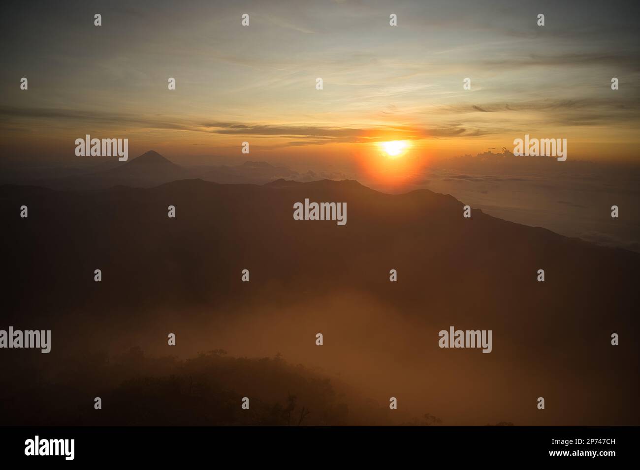 Epic sunrise on the top of the mountain Inerie on Flores, the sun ...