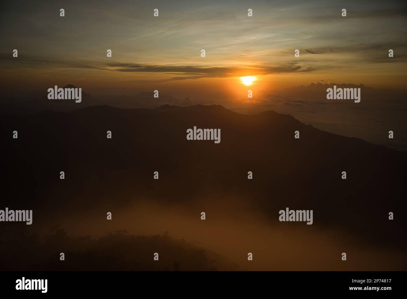 Epic sunrise on the top of the mountain Inerie on Flores, the sun ...