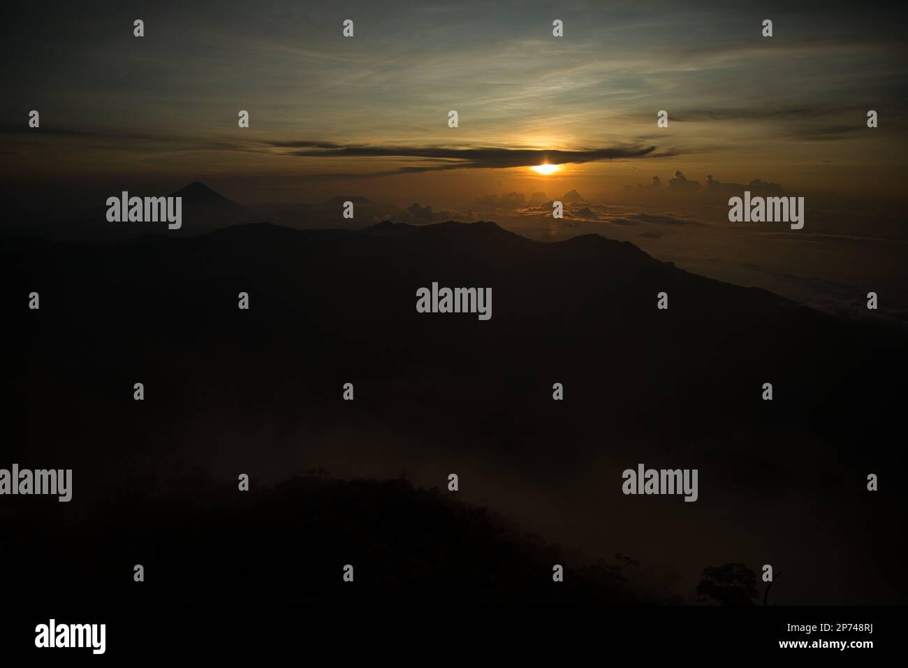 Epic sunrise on the top of the mountain Inerie on Flores, the sun ...