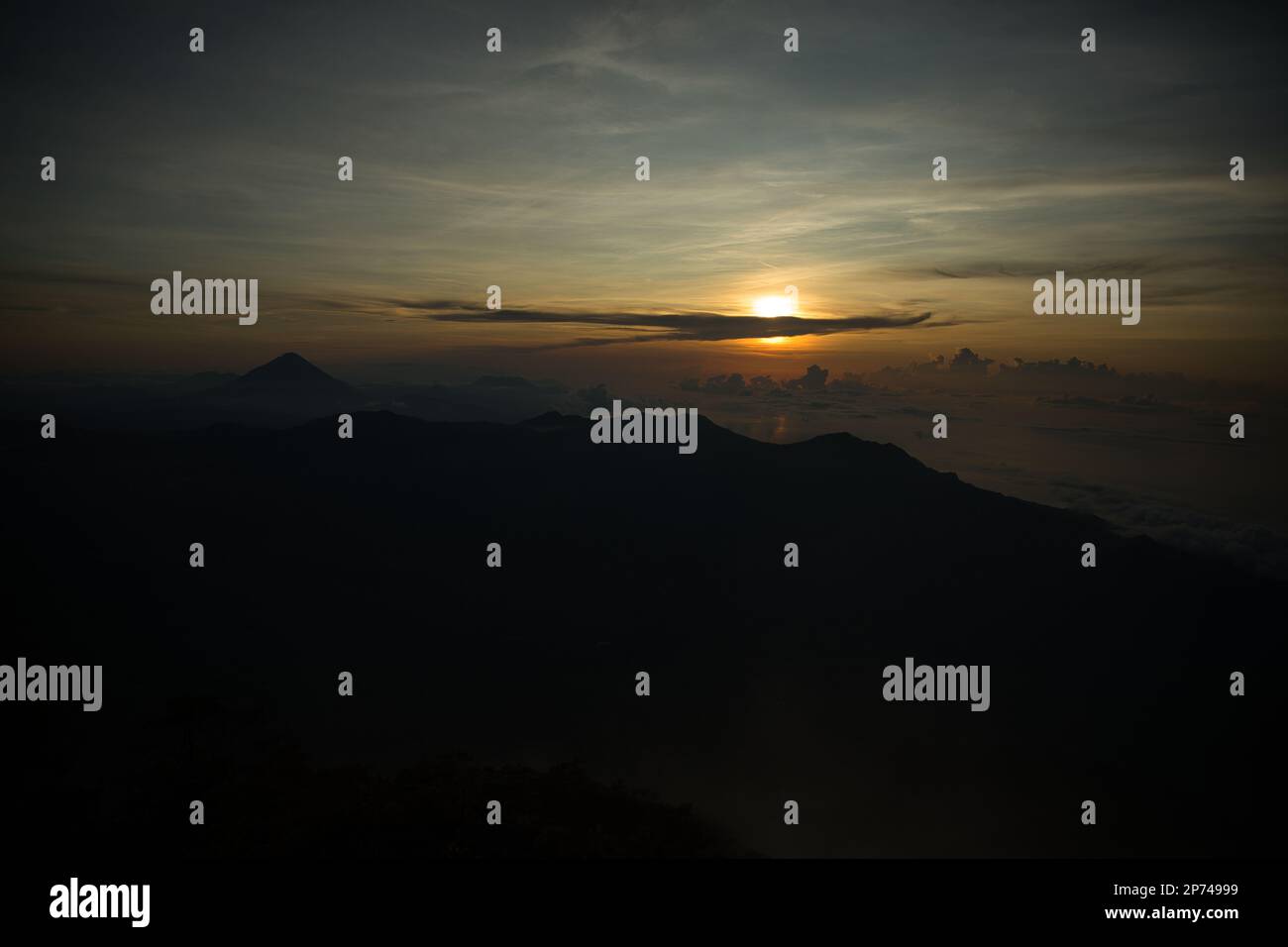 Epic sunrise on the top of the mountain Inerie on Flores, the sun ...