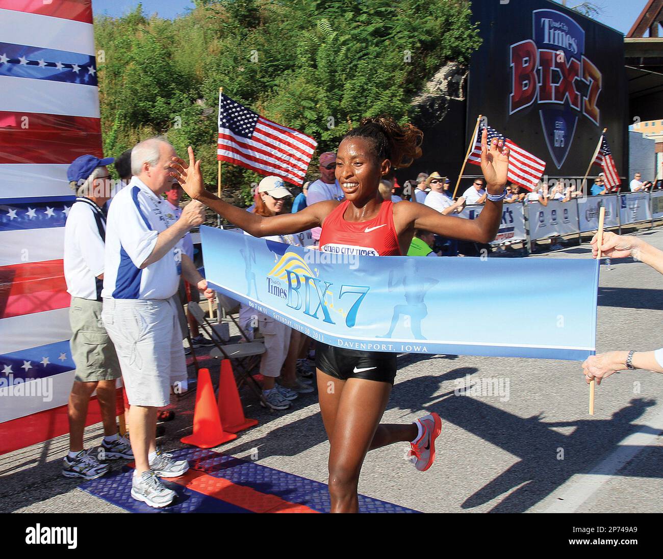 Caroline Rotich from Kenya, crosses the finish line first for the women ...