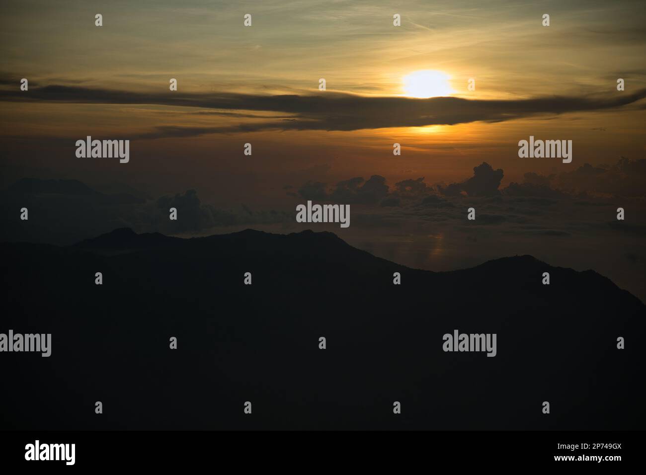 Epic sunrise on the top of the mountain Inerie on Flores, the sun ...