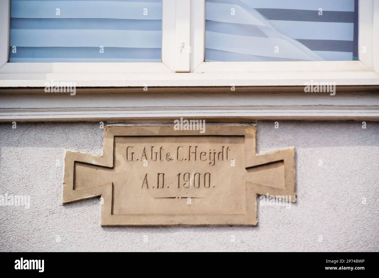 Old inscriptions carved stone on the facade of a house G. Abt and C ...