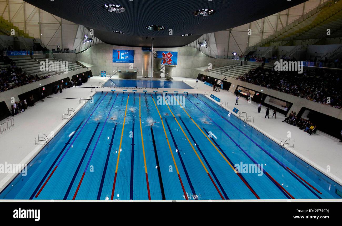 A swimming race takes place in the new aquatic centre swimming pool at ...