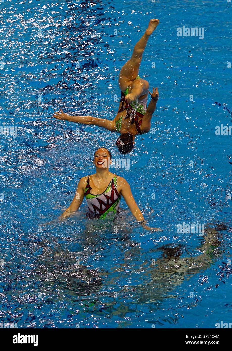 A synchronized swimming display takes place in the new aquatic centre ...