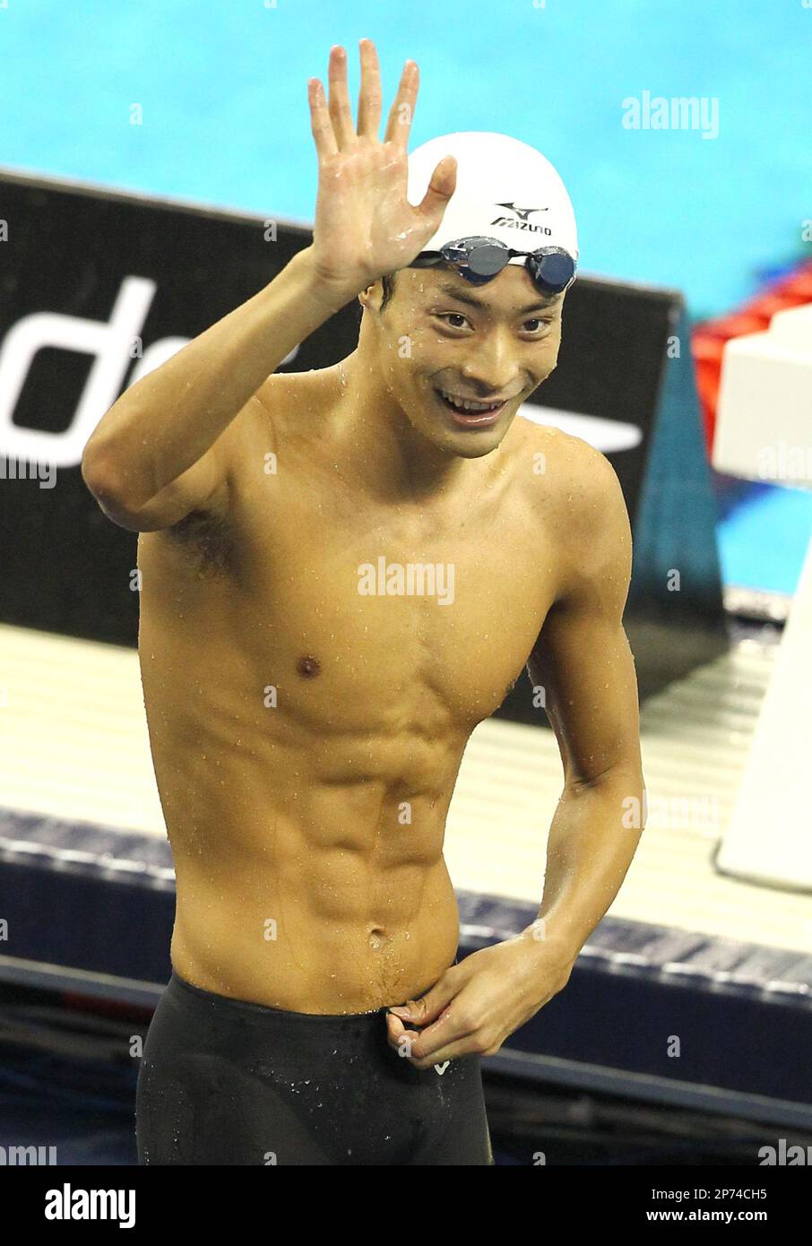 Japan's Ryosuke Irie waves his hand after his heat at the final of the men's 100-meter ...