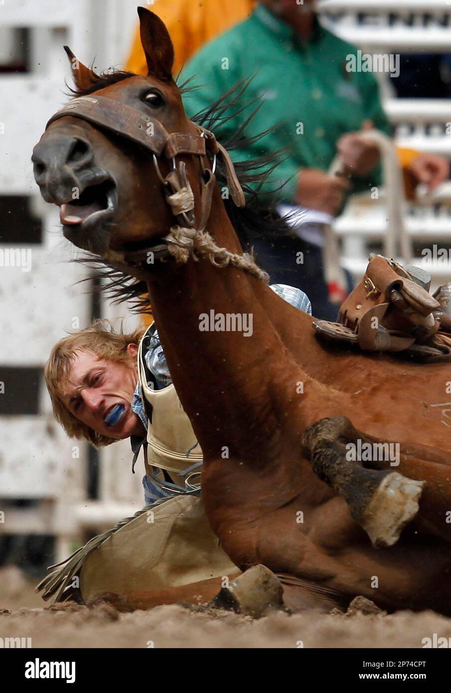Allen Boore from Axtell, Utah, lies on the ground after he and his ...