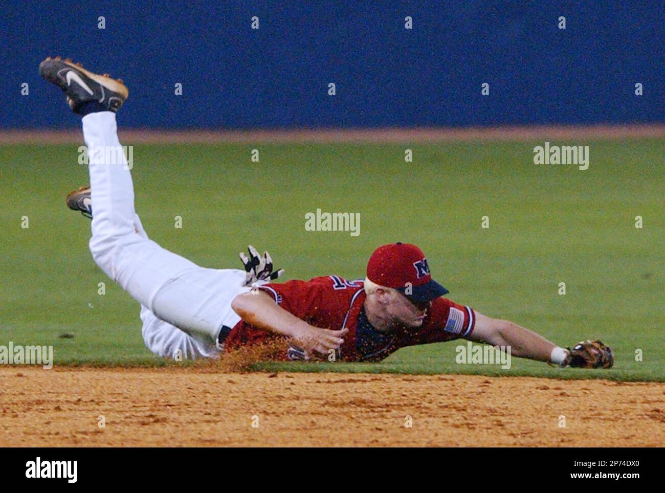 The ball gets past a diving Mississipi shortstop Zack Cozart against ...