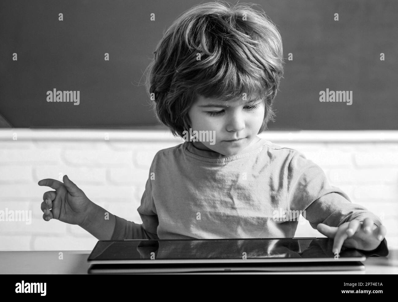Schoolboy with digital tablet in school classroom. Kids Science ...