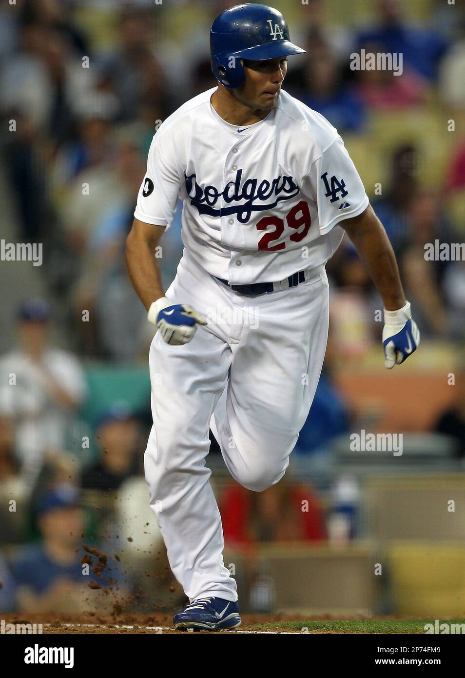 Los Angeles Dodgers pitcher Ted LIlly runs to first during the fourth ...